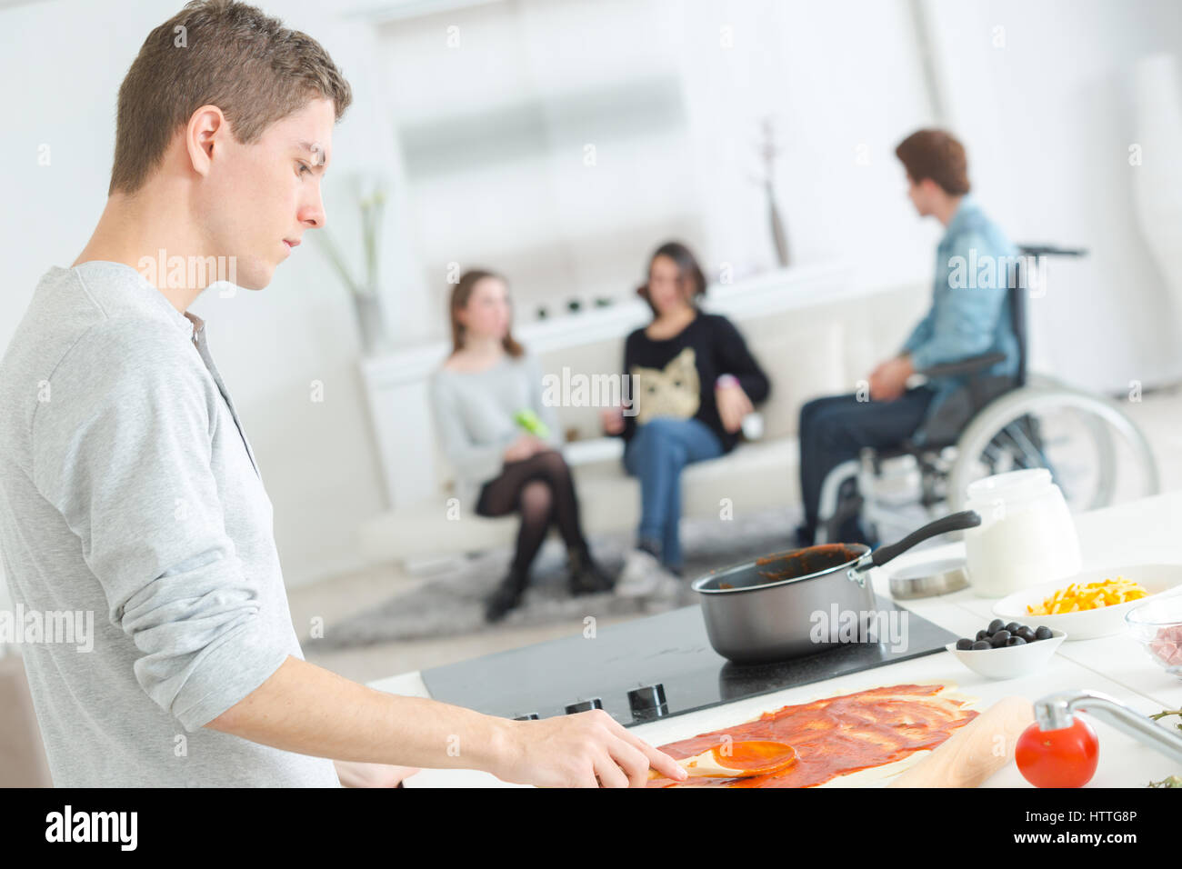 Cooking for a disabled friend Stock Photo - Alamy
