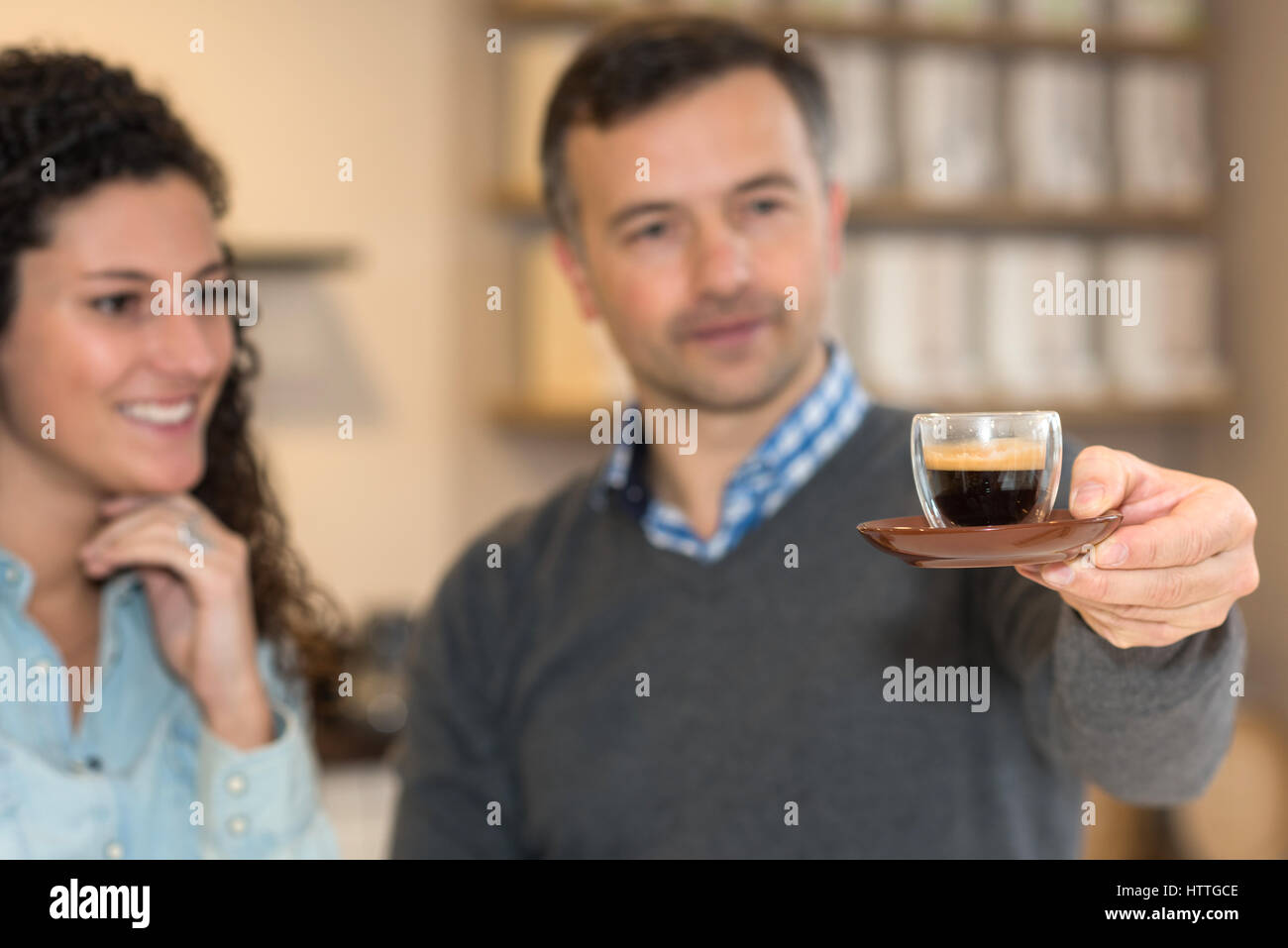 inspecting a cup of coffee Stock Photo - Alamy
