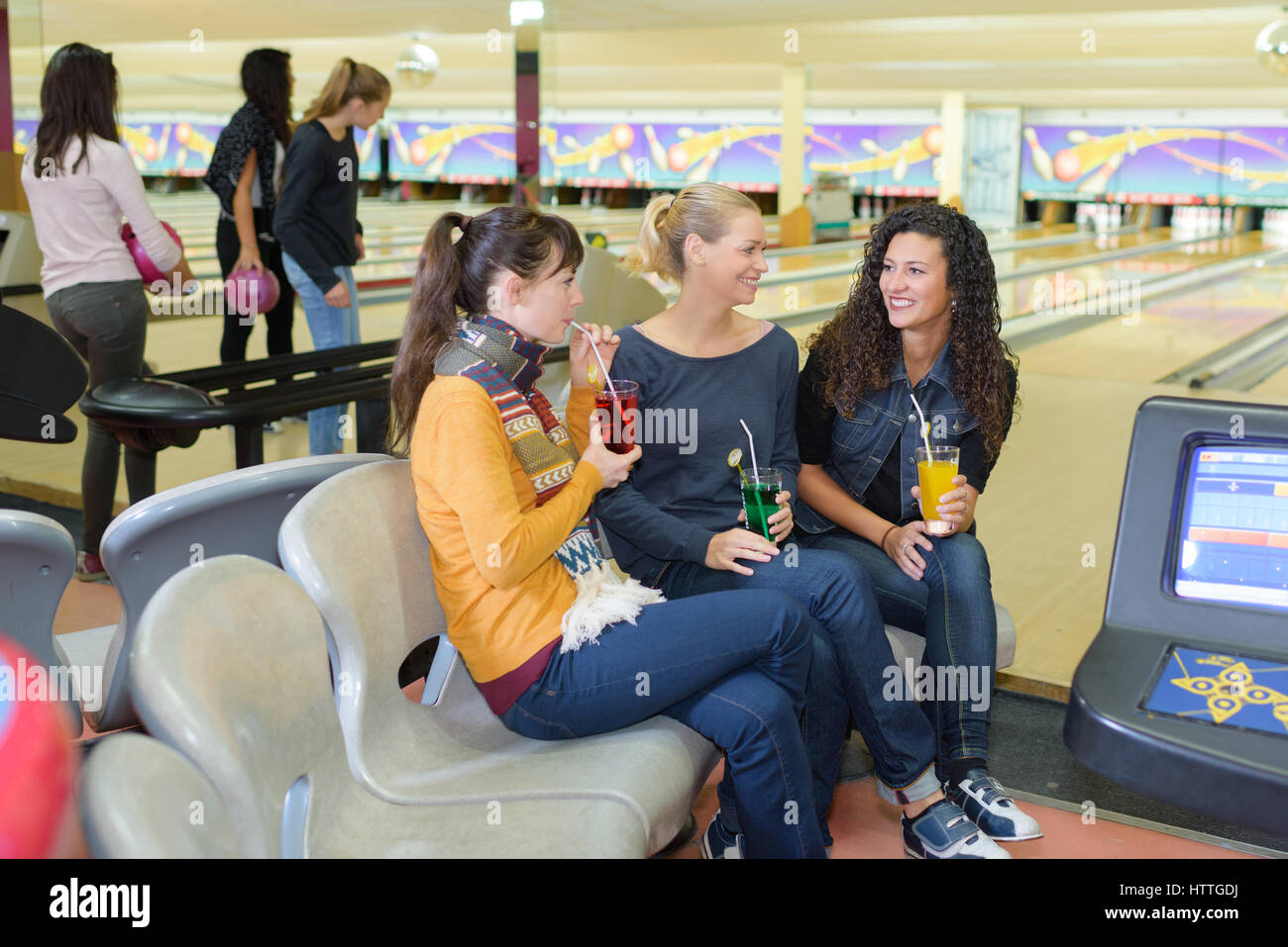 Women drinking in bowling alley Stock Photo - Alamy