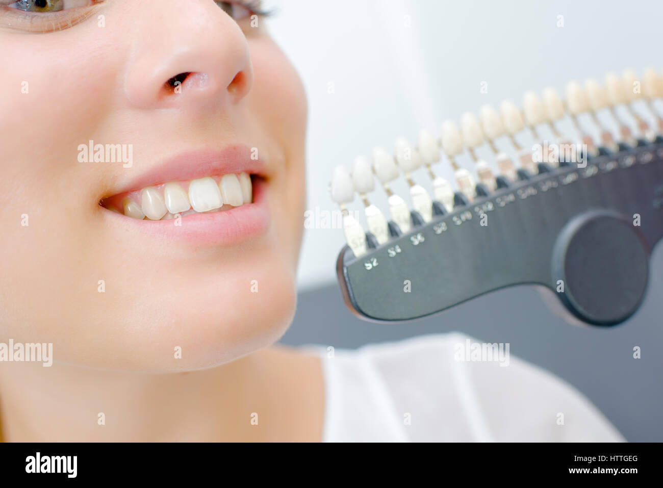 Lady holding teeth samples Stock Photo - Alamy