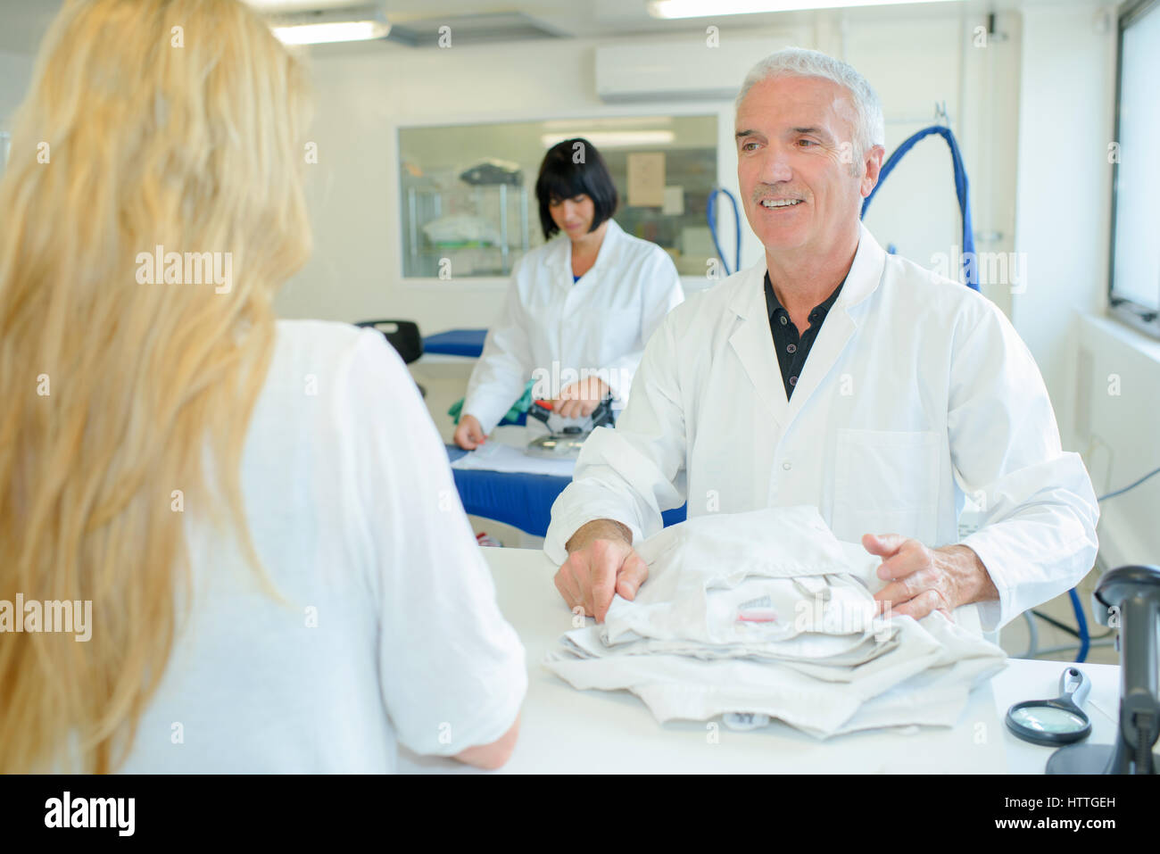 People in professional laundry Stock Photo - Alamy