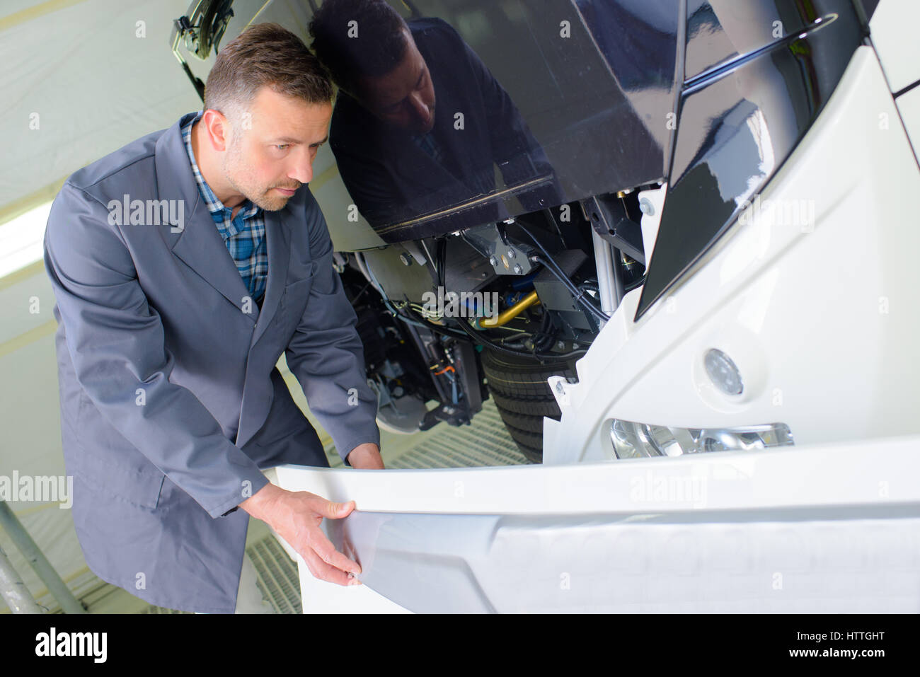 fixing the bus front Stock Photo - Alamy