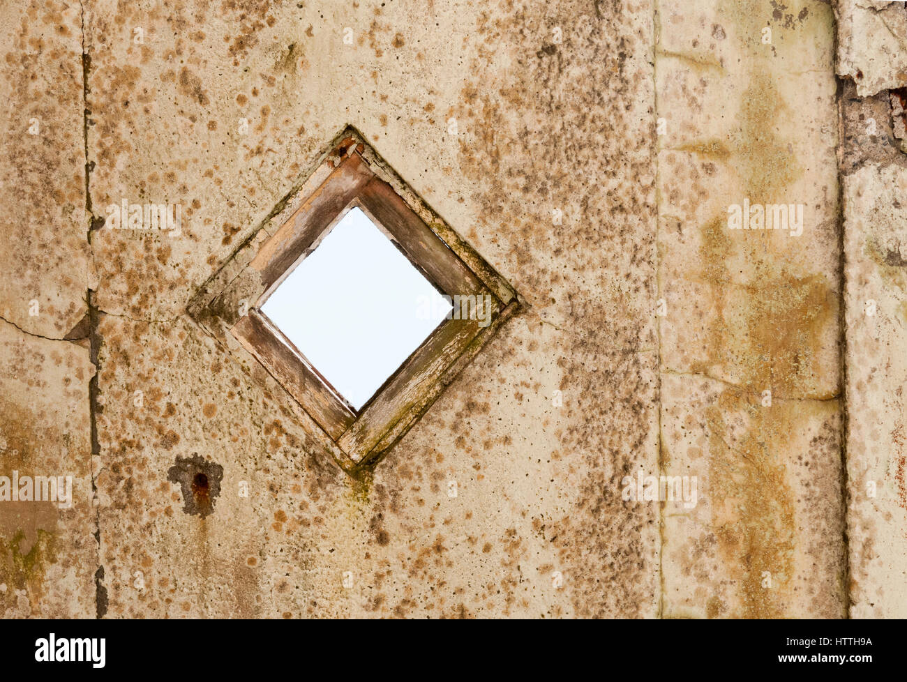 small triangular window on rusted steel wall Stock Photo - Alamy