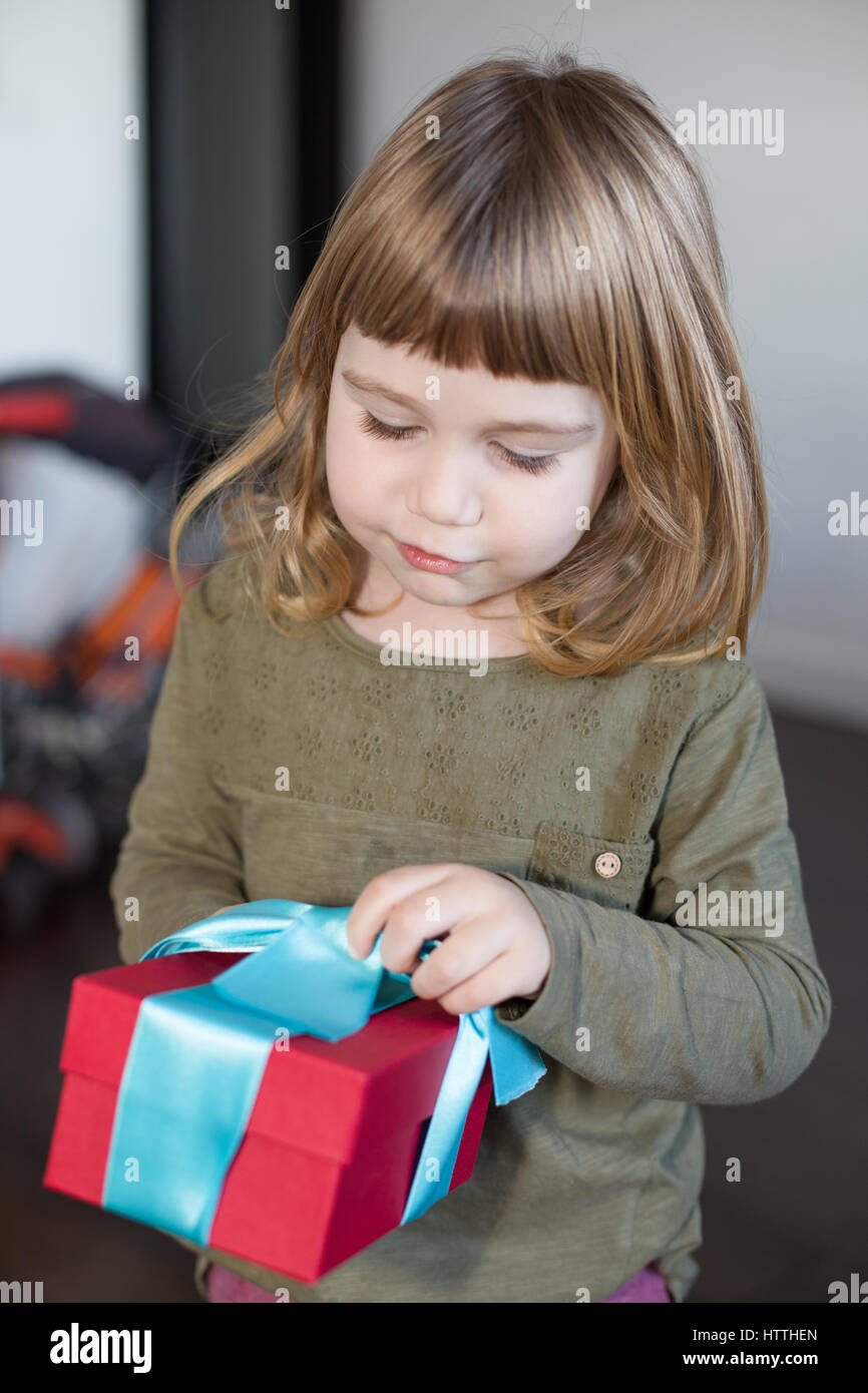 portrait of three years old caucasian blonde child, with green shirt ...