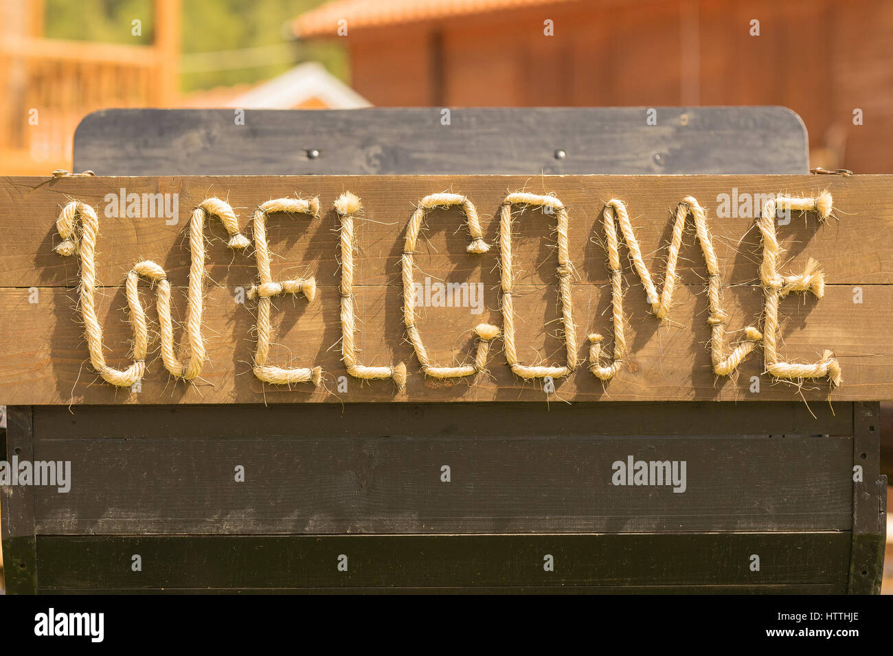 Welcome message made of ropes outside of a saloon Stock Photo - Alamy
