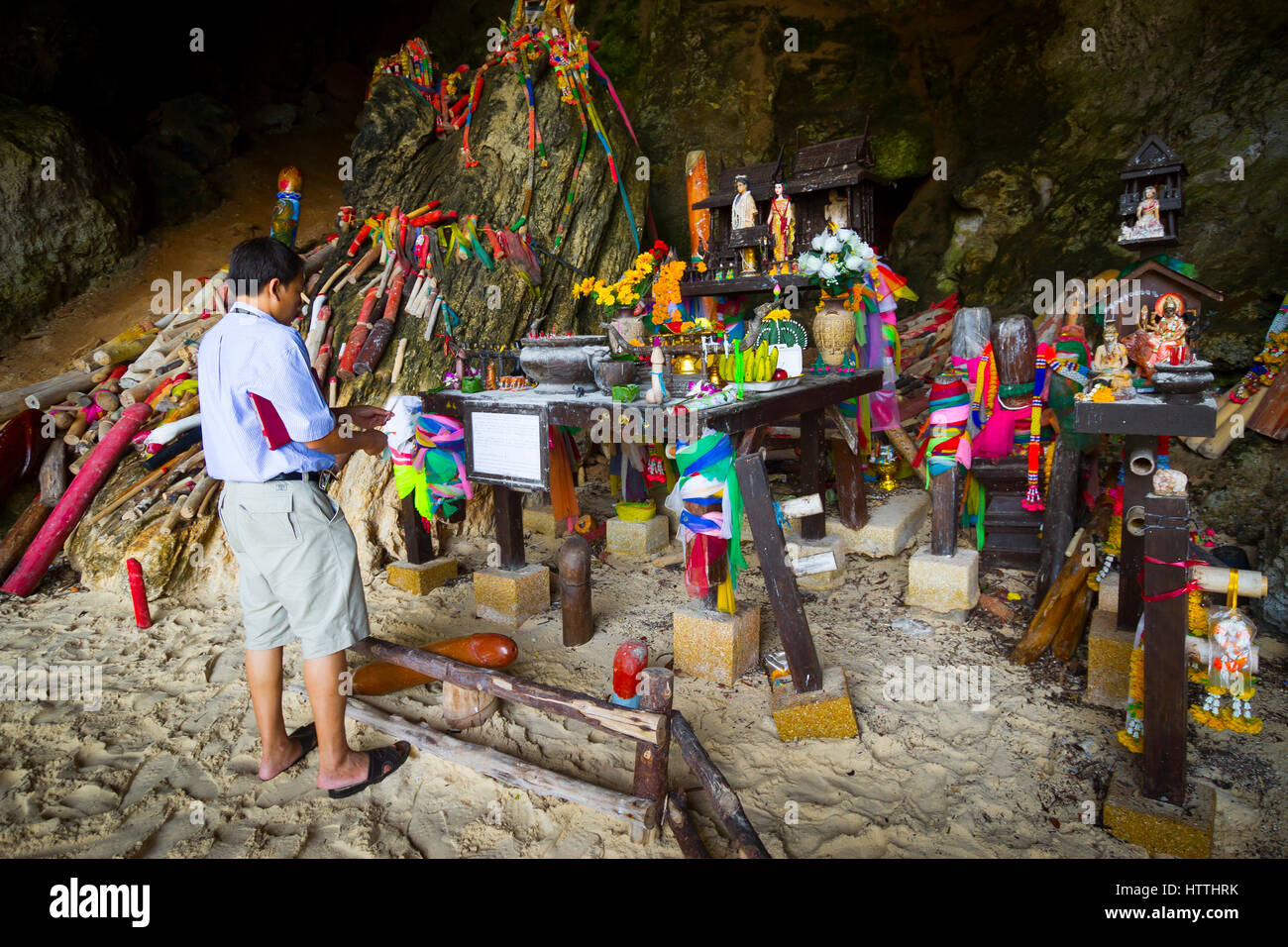 Man in Princess Cave or Tham Phra Nang Nok. Pranang Cave Beach. Railay ...