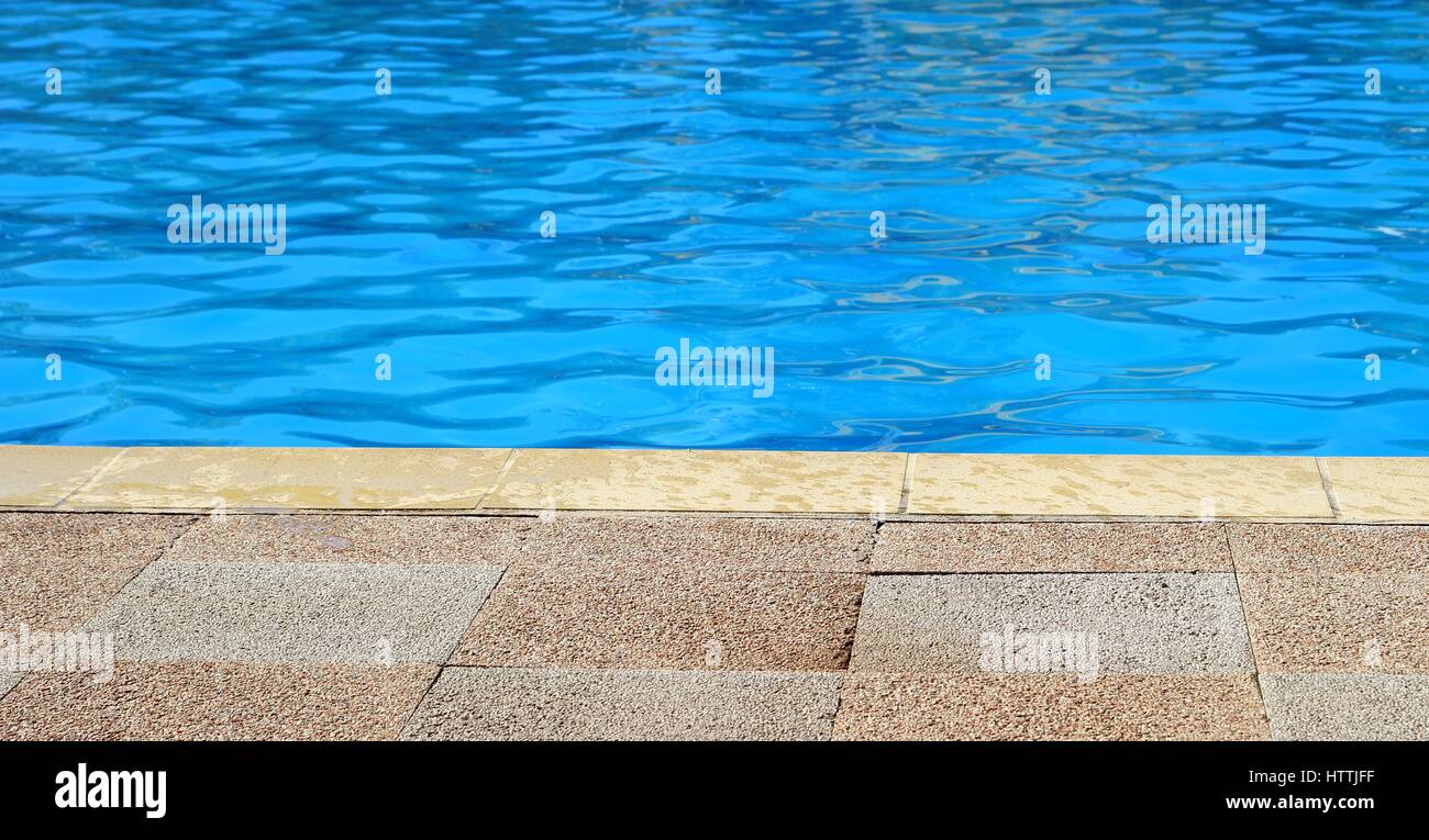 Edge of outdoor swimming pool for background with copy space Stock ...