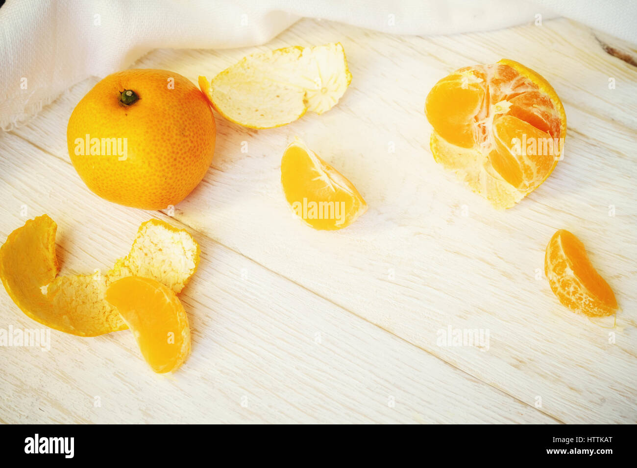 Whole and peeled tangerines Stock Photo - Alamy