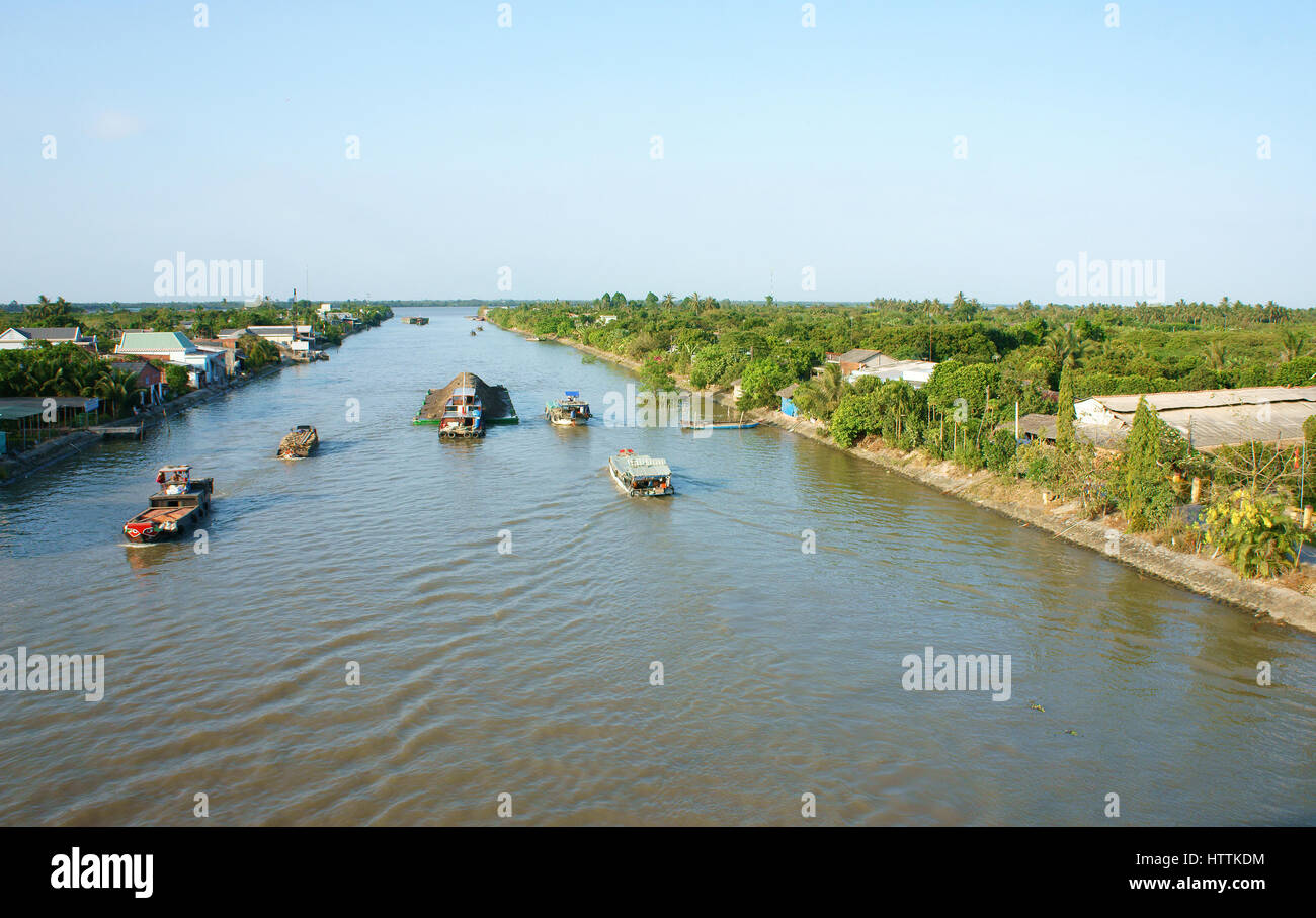 Group of Asia ship with river traffic on Mekong Delta river to ...