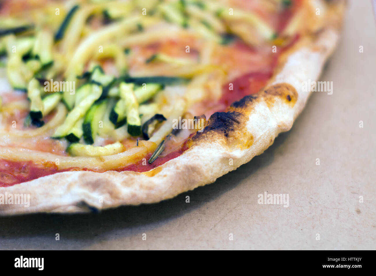 Close up of a tasty italian real pizza with zucchini and potatoes Stock ...