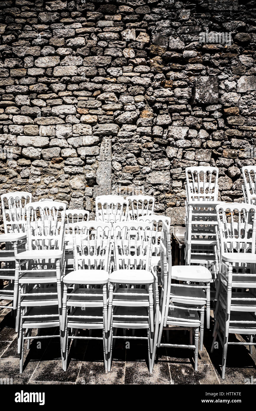 Big group of chairs in a medieval garden Stock Photo - Alamy