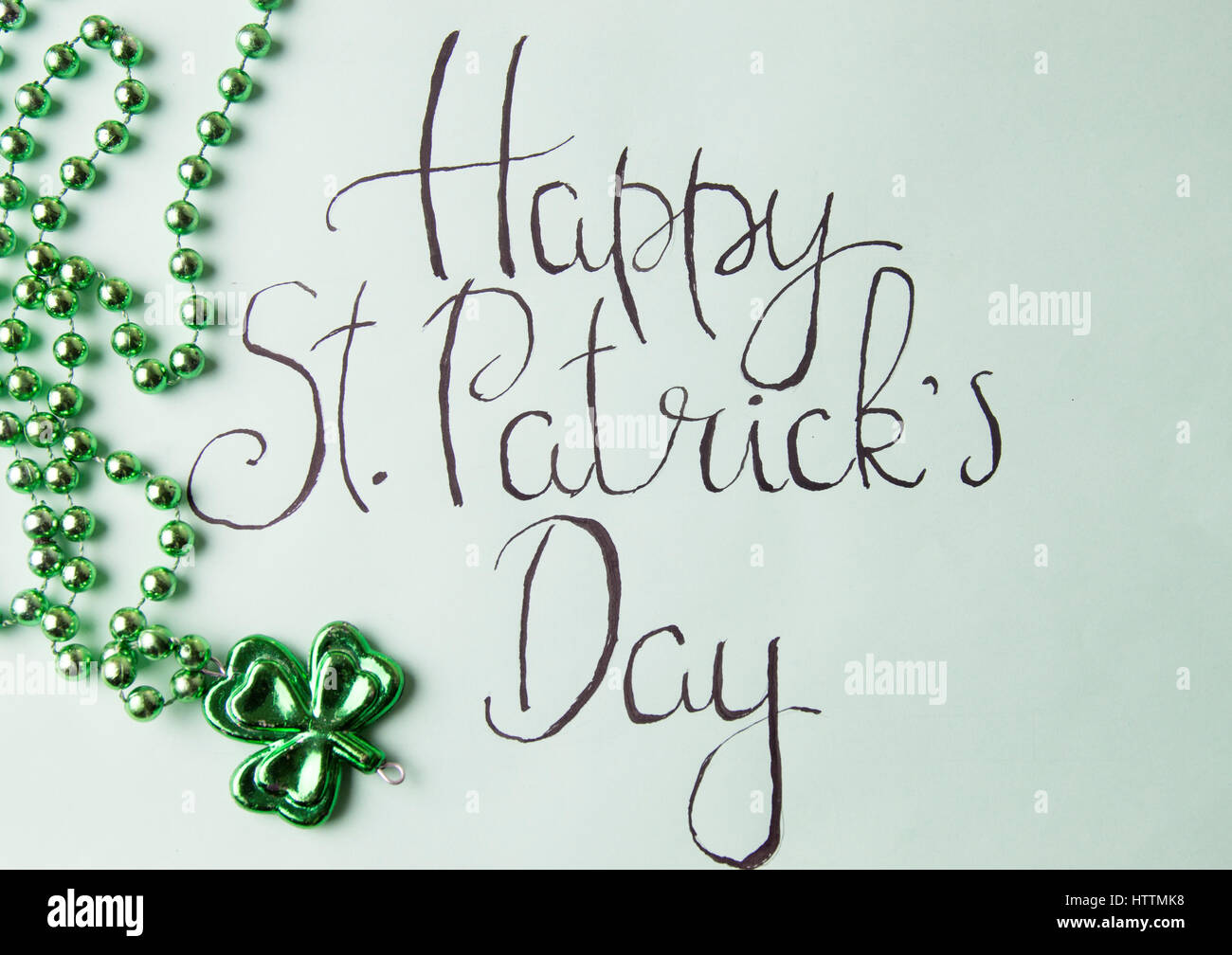 Happy St Patrick day calligraphy card and green accessories Stock Photo ...