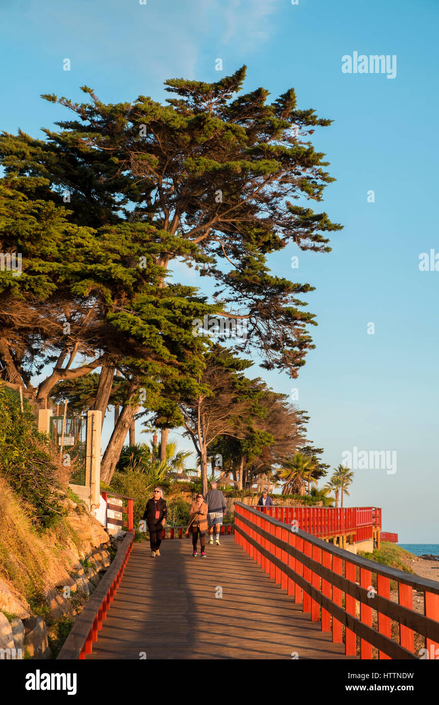 Wooden walkway, seafront promenade, connecting beaches of Costa del Sol ...