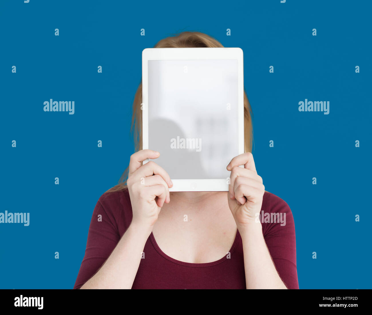 Woman Holding Up Tablet Covering Face Stock Photo - Alamy