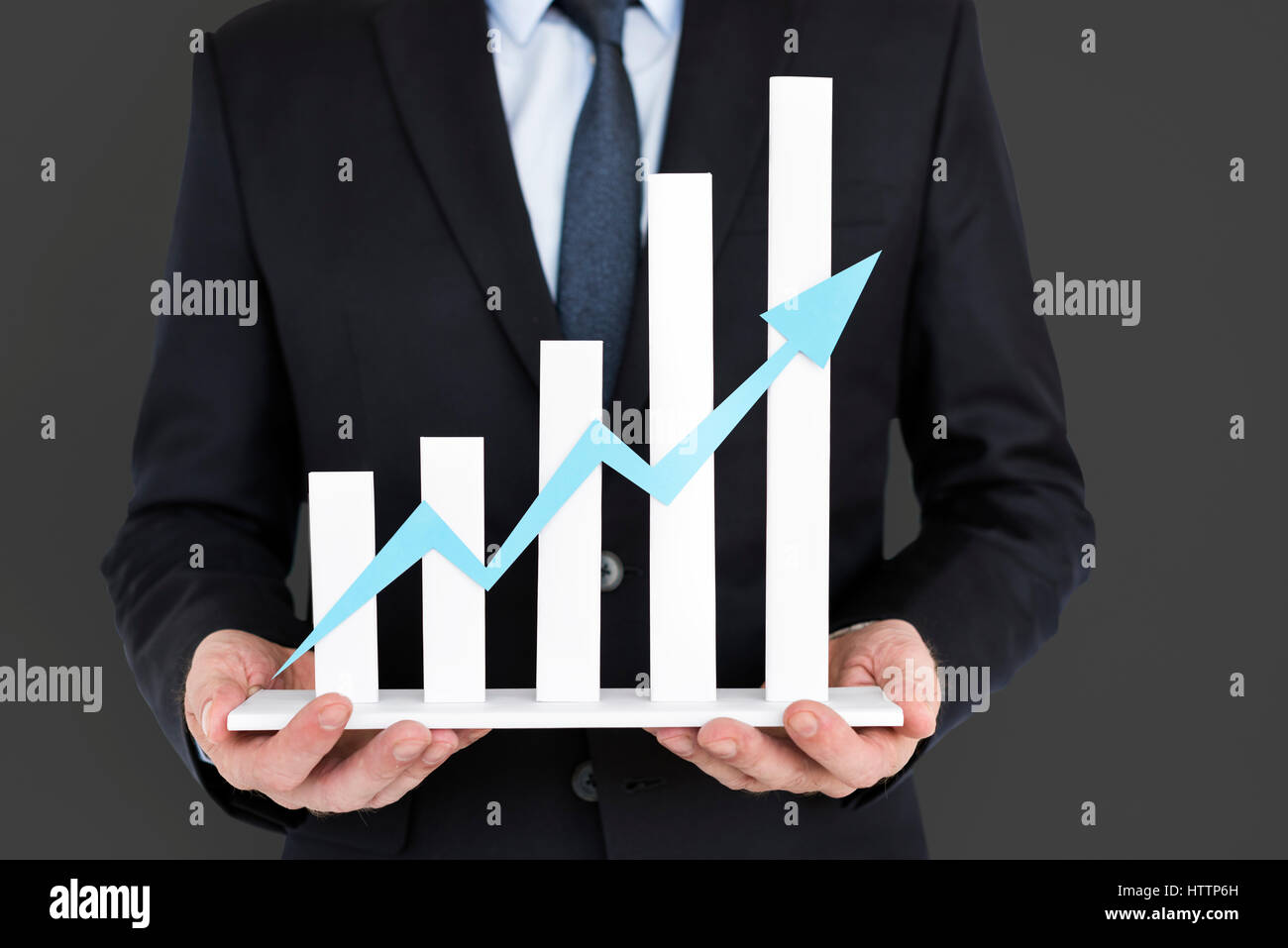 Business man holding graph hi-res stock photography and images - Alamy