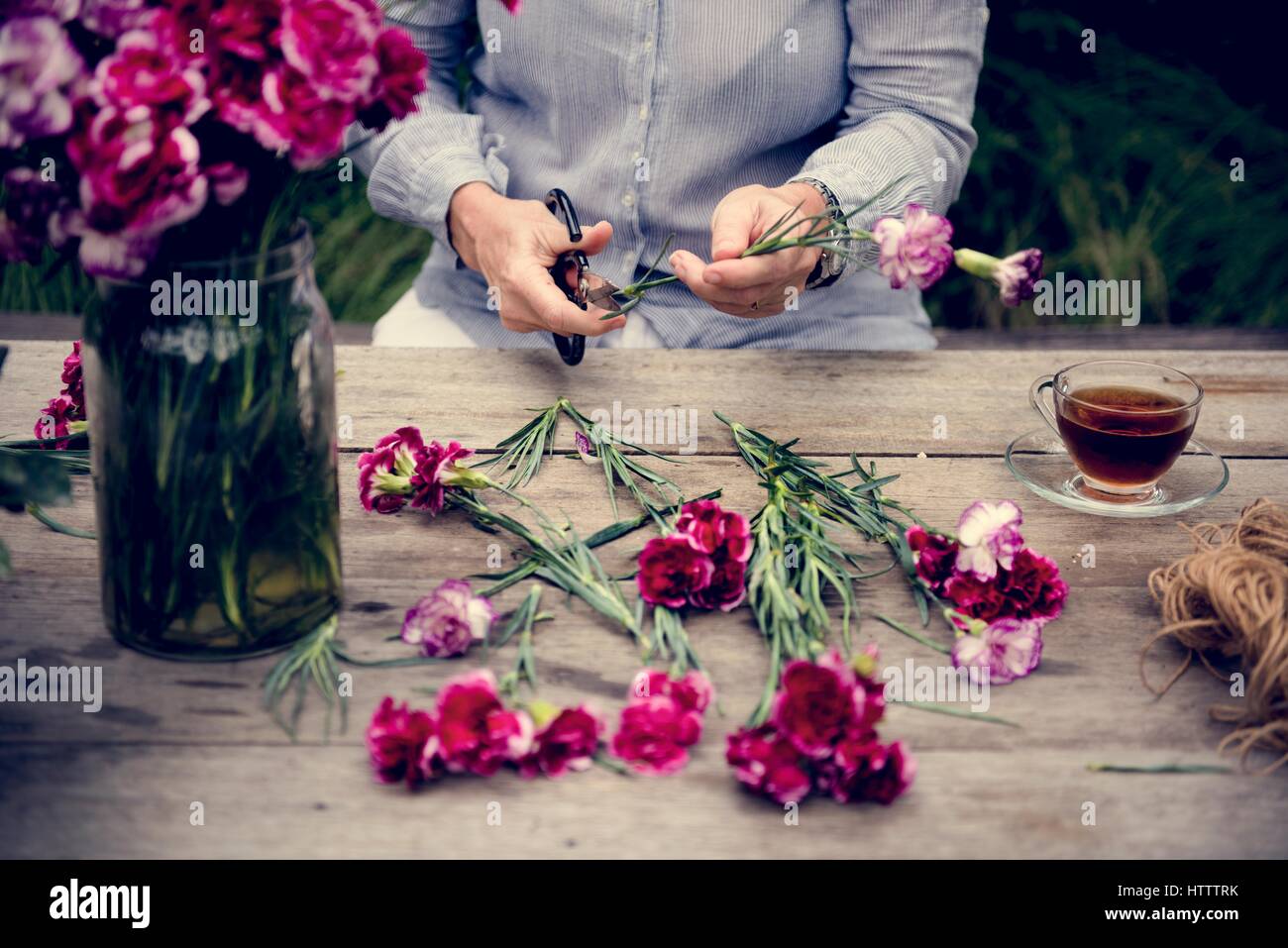 Hobby Lady Mature Flower Arrangement Stock Photo - Alamy