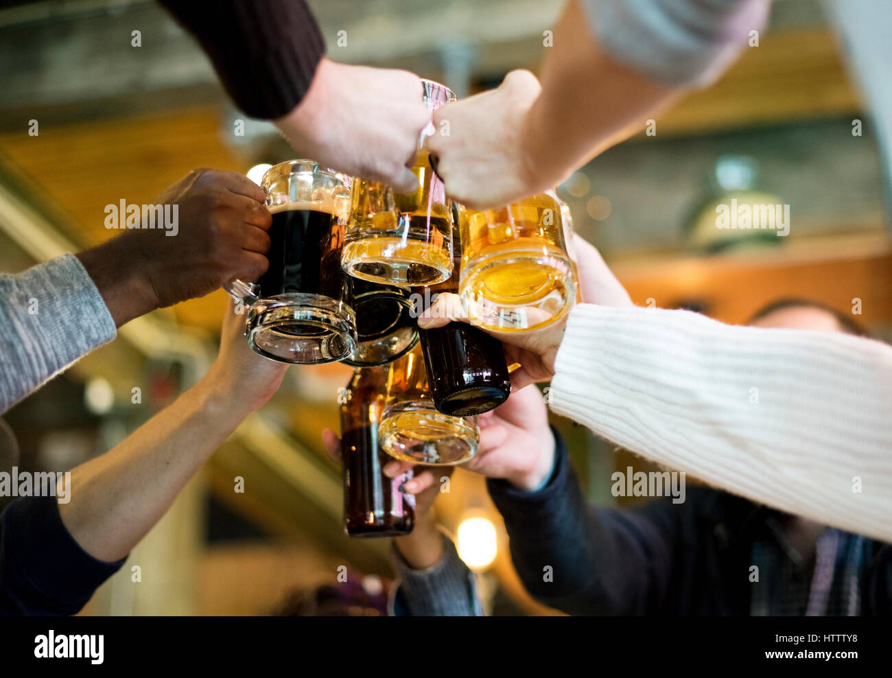 Hands Hold Beverage Beers Bottle Cheers Stock Photo - Alamy