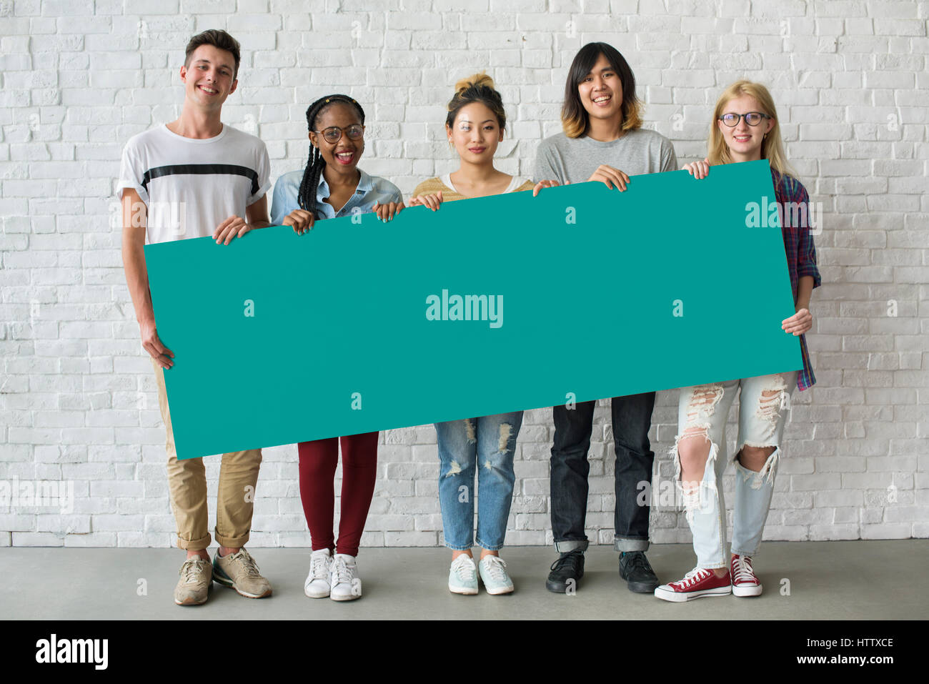 Group of Friends Holding Blank Banner Stock Photo - Alamy