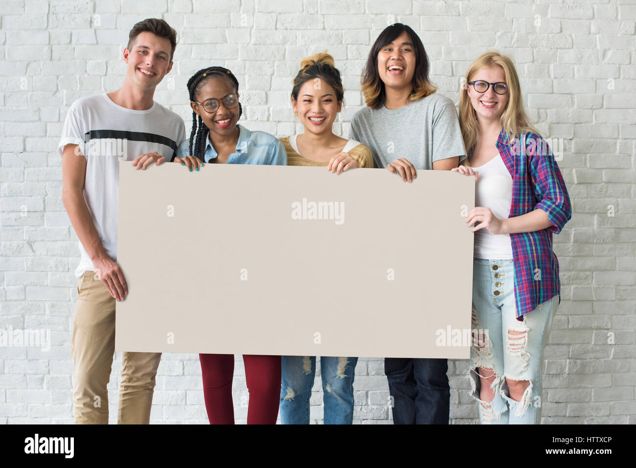 Group of Friends Holding Blank Banner Stock Photo - Alamy
