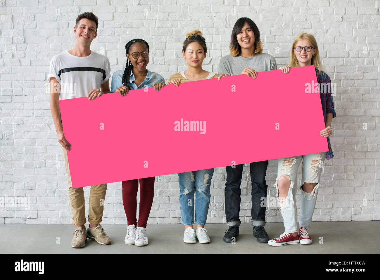 Group of Friends Holding Blank Banner Stock Photo - Alamy