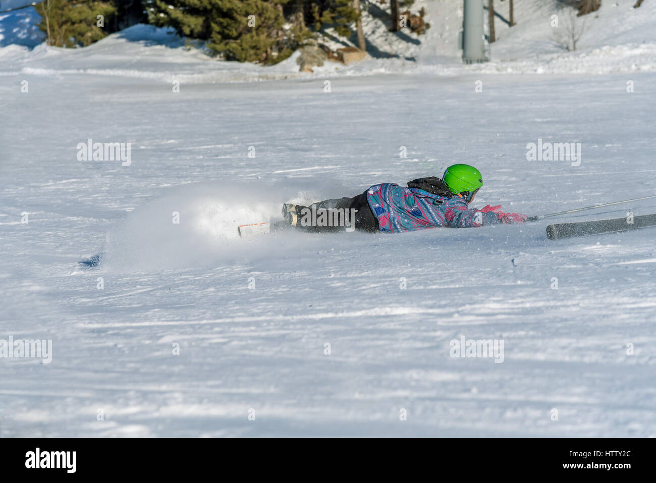 boy skier falling obliquely in winter days Stock Photo - Alamy