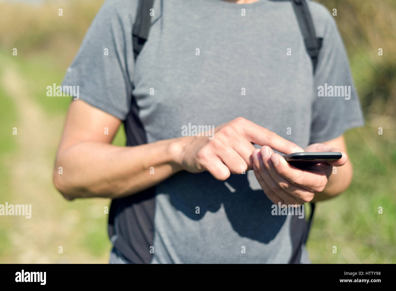 Young man carrying a backpack hi-res stock photography and images - Alamy