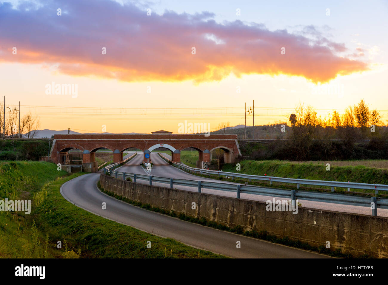 Railway bridge over road in Tuscany, Italy Stock Photo - Alamy