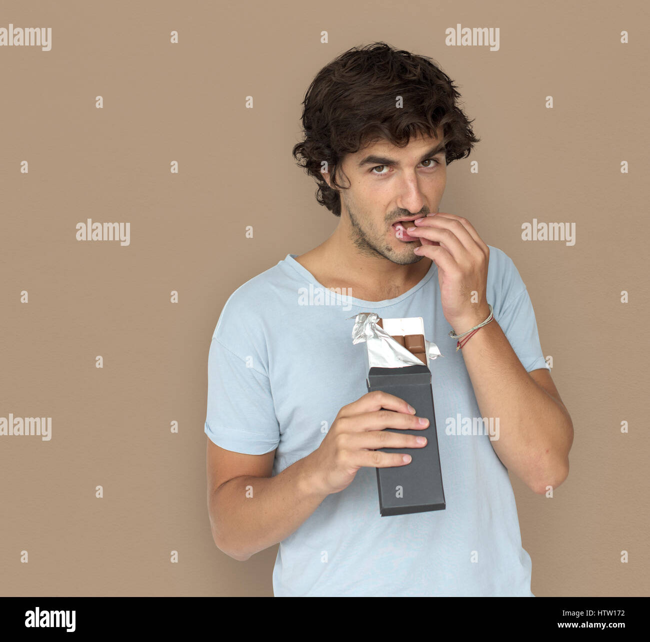 Man eating chocolate hi-res stock photography and images - Alamy