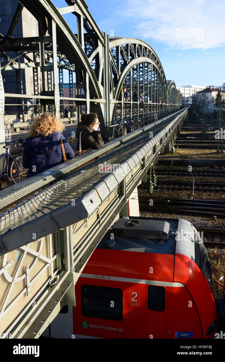 München, Munich, people sitting in the framework of road bridge ...