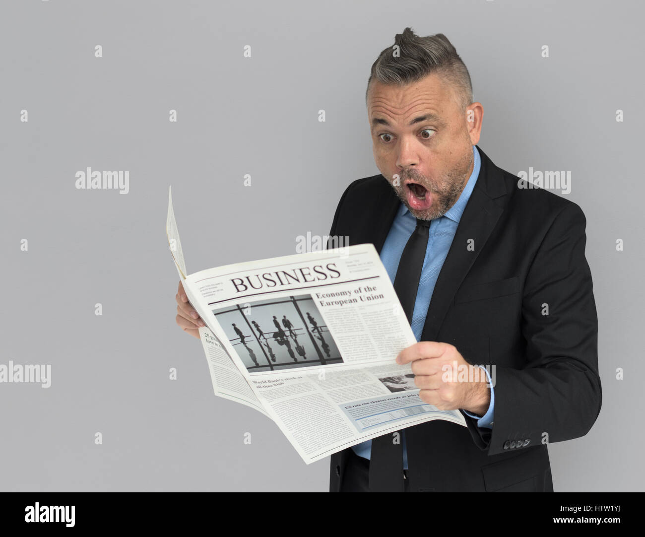 Caucasian Business Man Reading Newspaper Shocked Stock Photo - Alamy