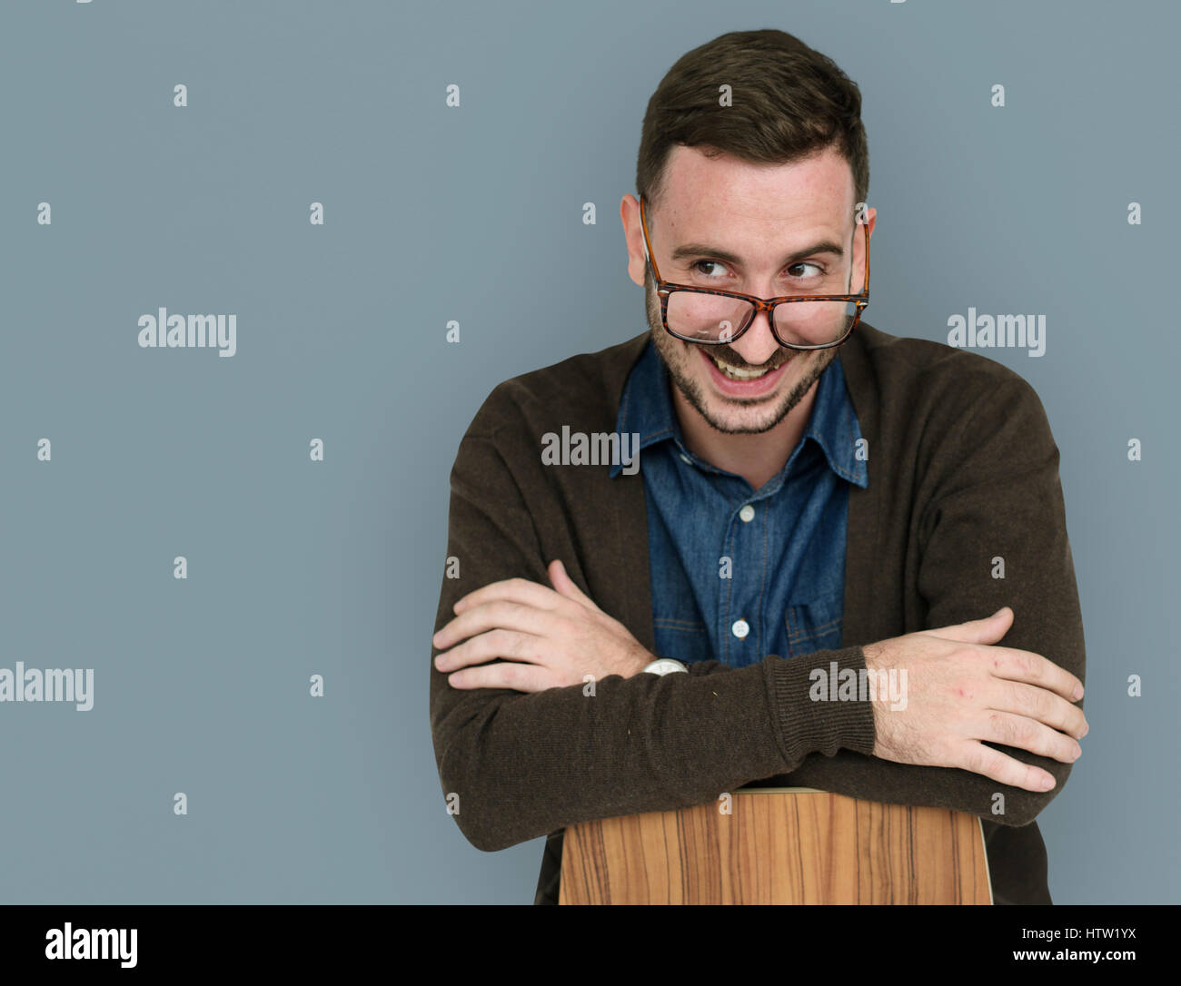 Caucasian Man Smiling Sitting Stock Photo - Alamy
