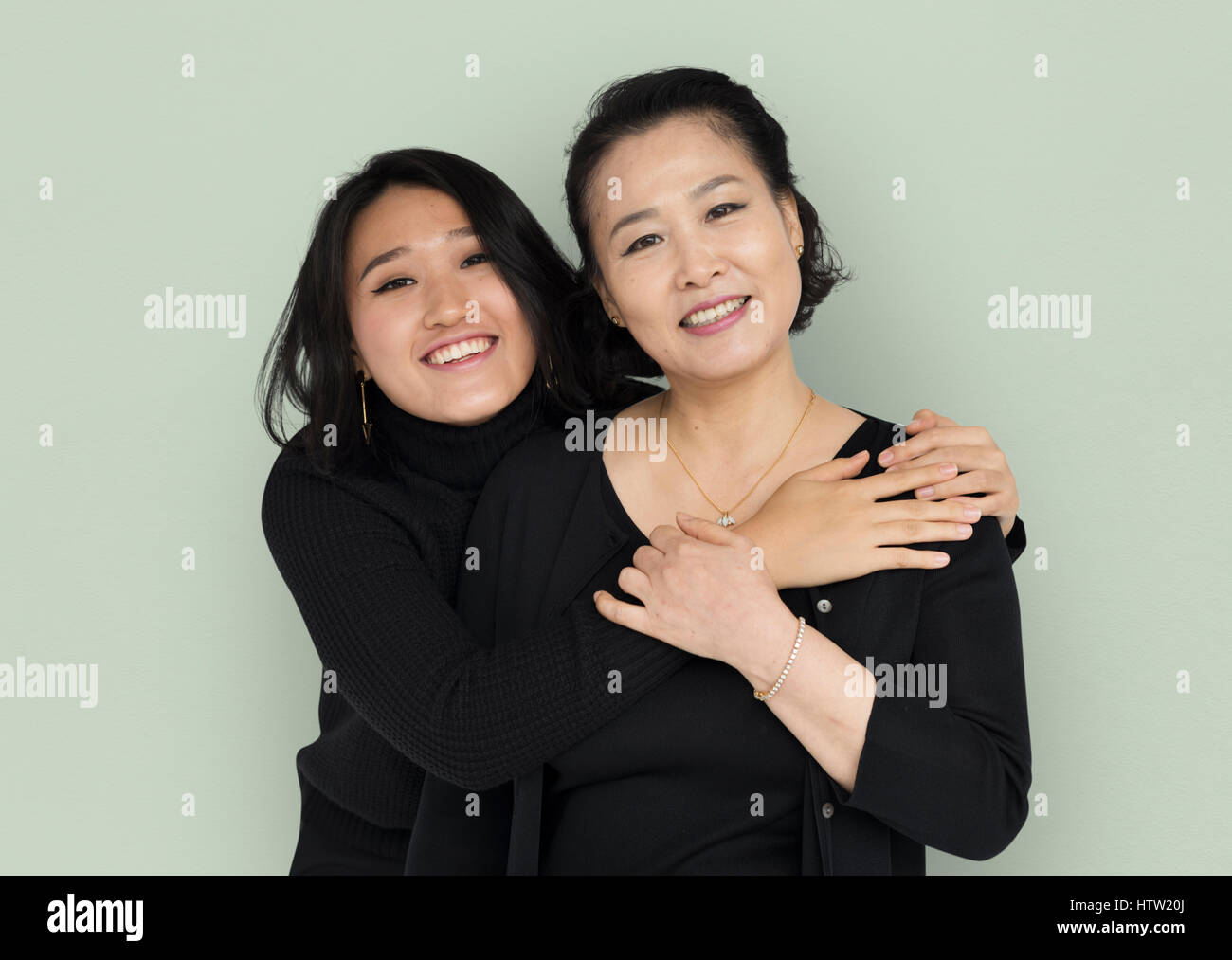 Asian Family Hug Smiling Stock Photo - Alamy
