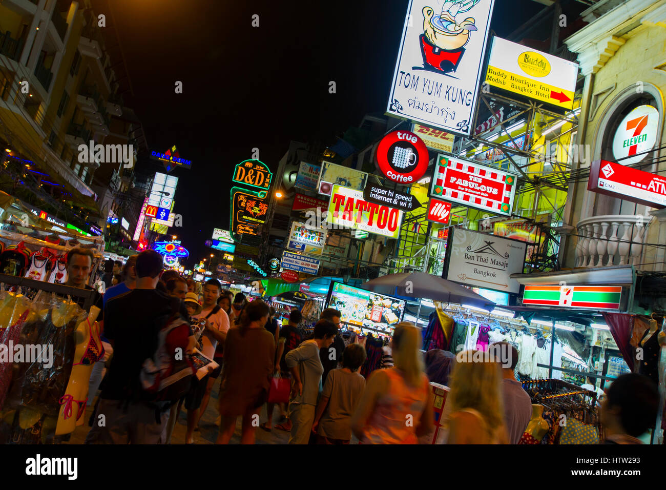 People and neon signs in Khao San street at night. Bangkok. Thailand ...