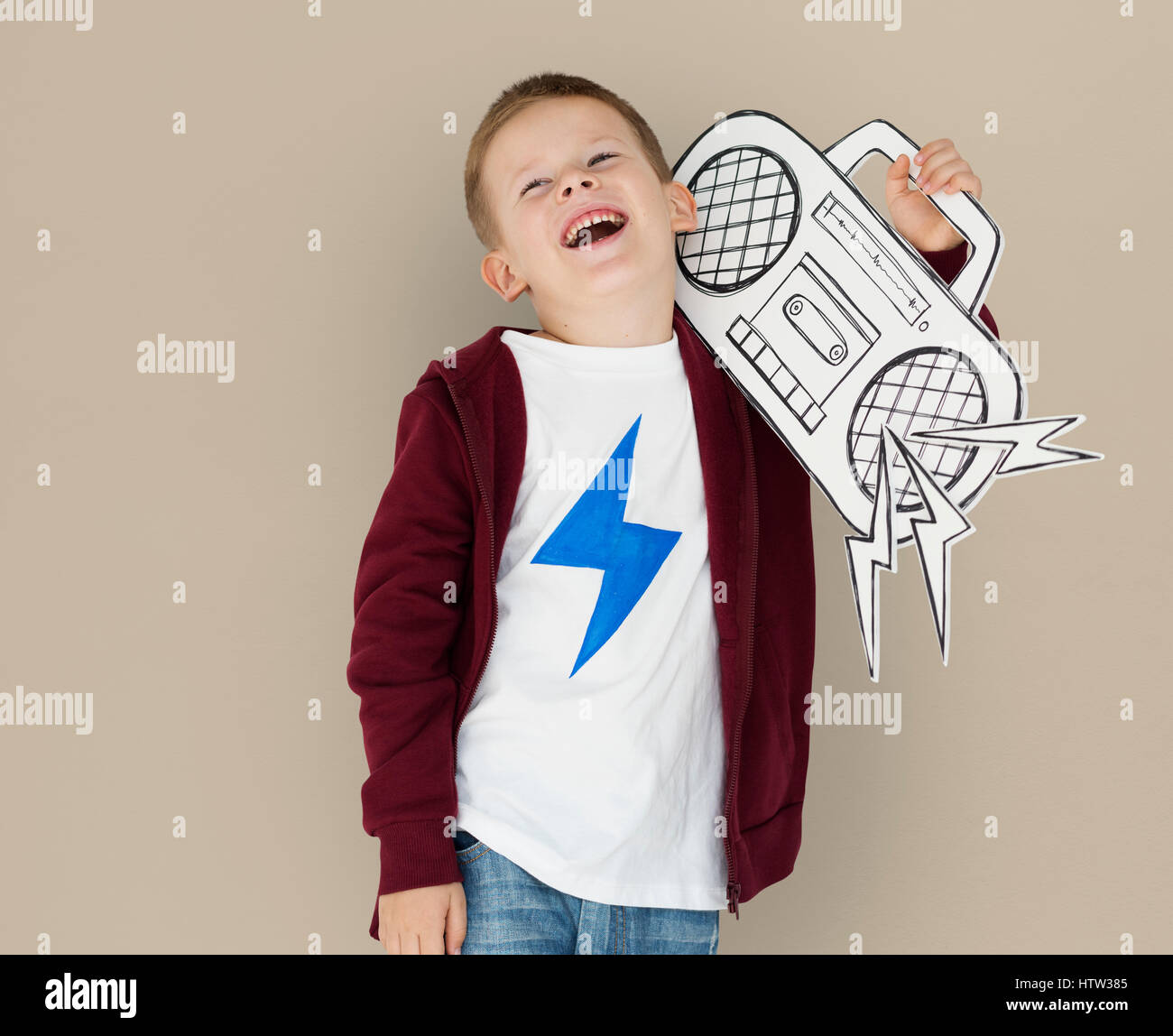 Caucasian Little Boy Holding Jukebox Stock Photo - Alamy