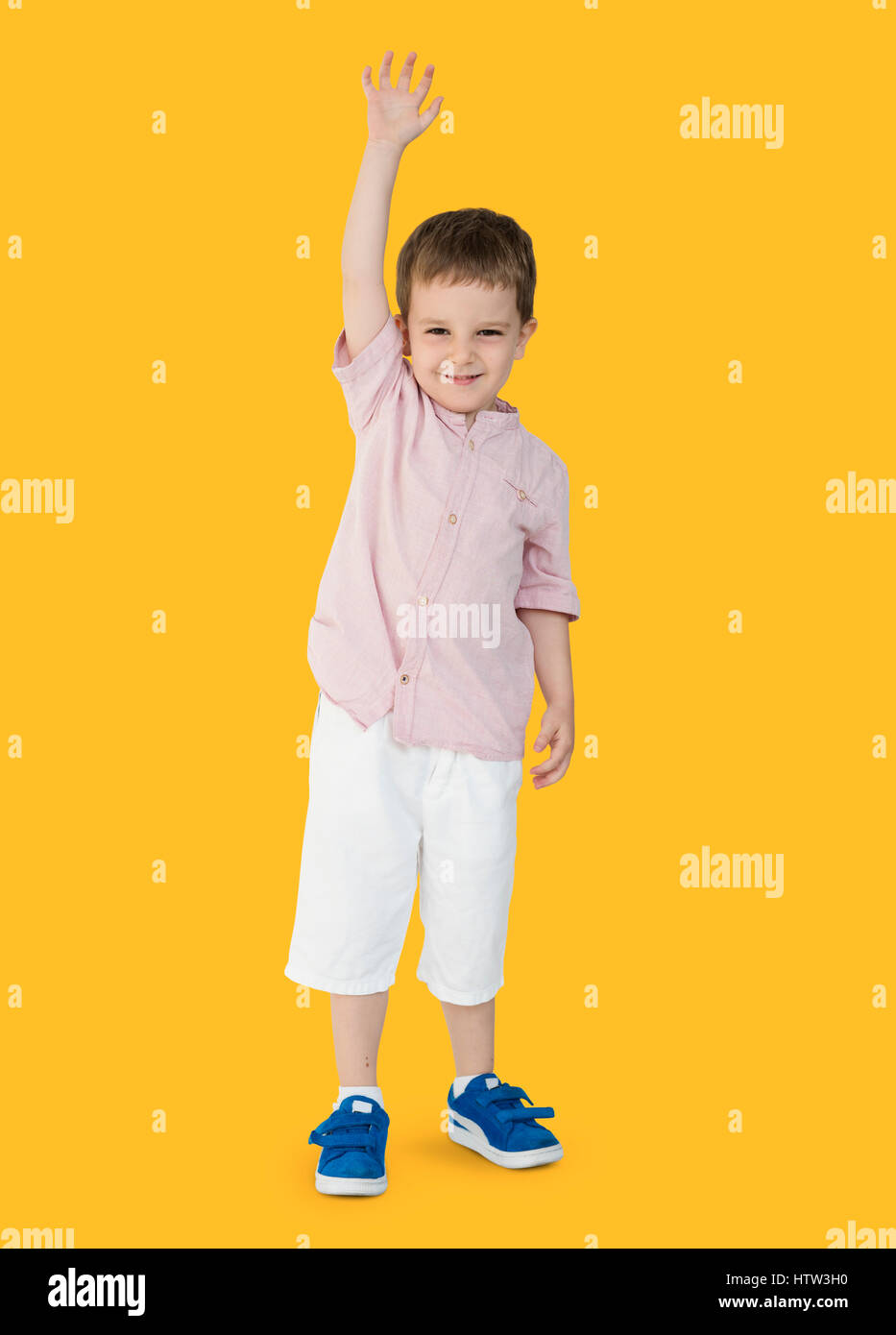 Caucasian Little Boy Cheerful Raising Hand Stock Photo - Alamy