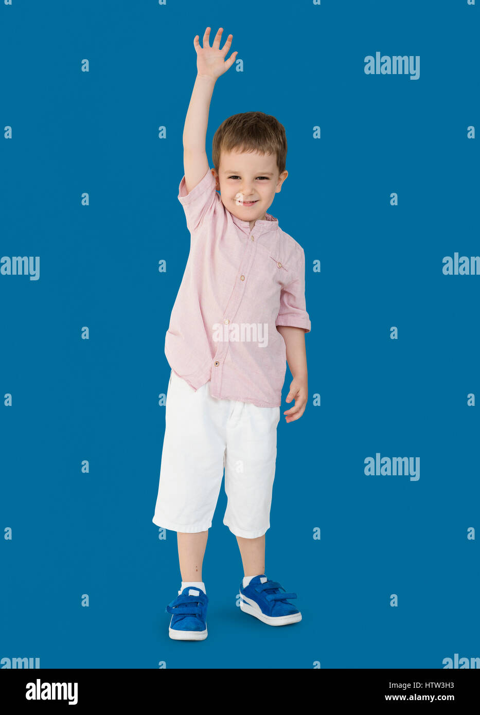 Caucasian Little Boy Cheerful Raising Hand Stock Photo - Alamy