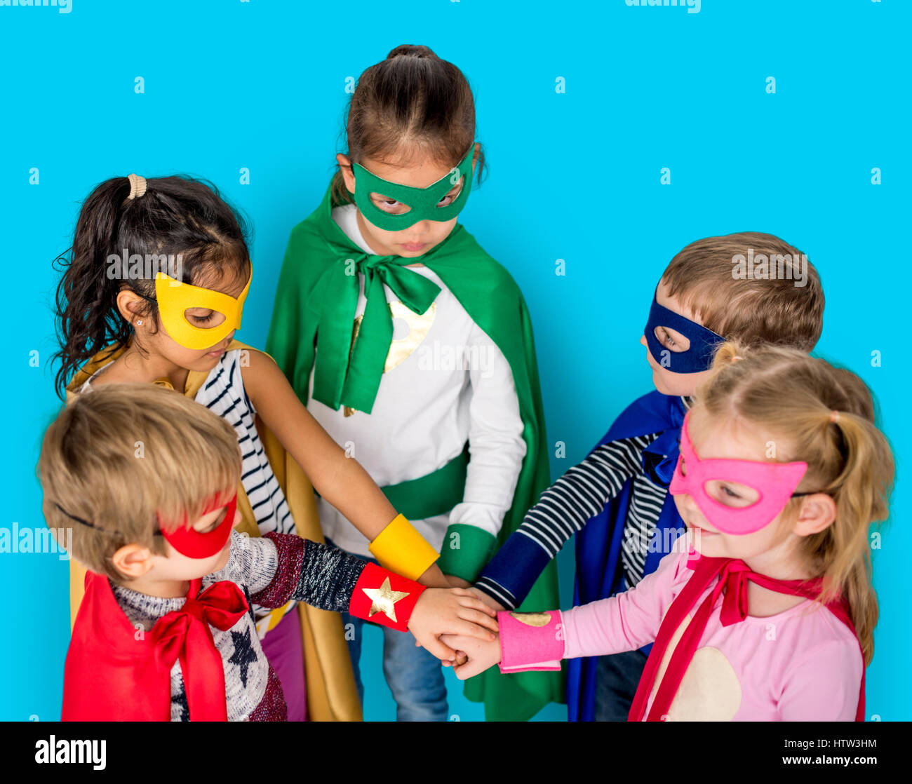 Little Kids Superhero Hands Together Teamwork Stock Photo - Alamy
