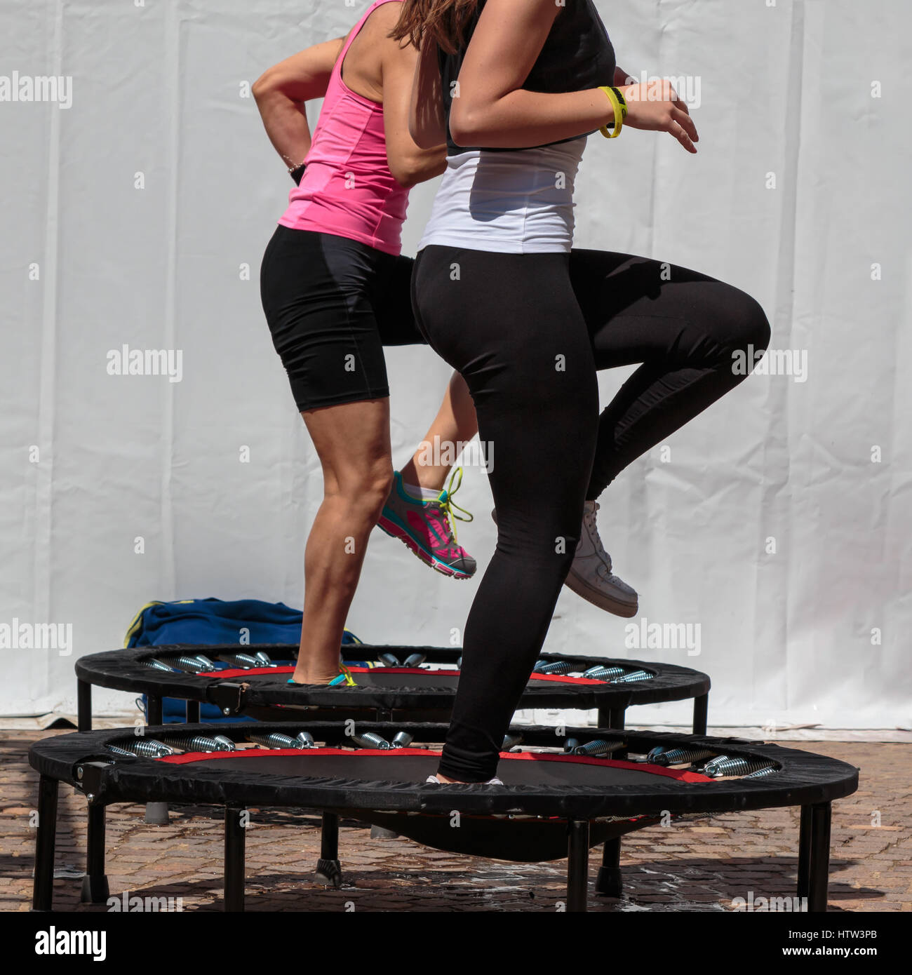 Mini Trampoline Workout: Girl doing Fitness Exercise in Class at Gym ...