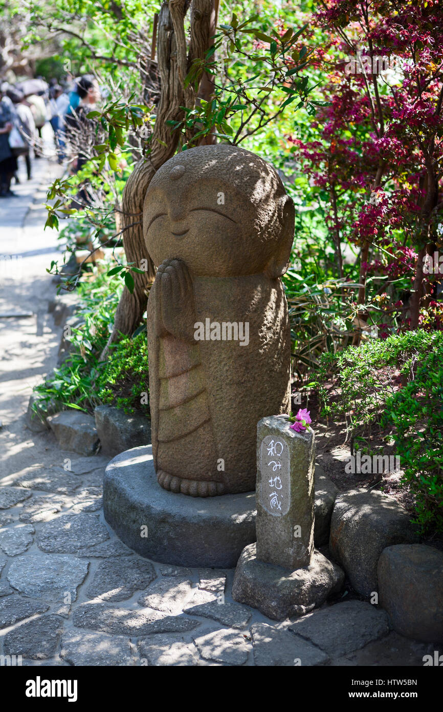 KAMAKURA, JAPAN - CIRCA APR, 2013: Charm stone praying buddha statue is ...