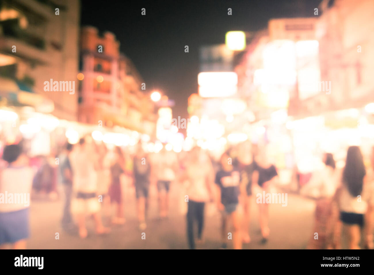 Blurred image of busy night life in the city. Defocused photo of night ...