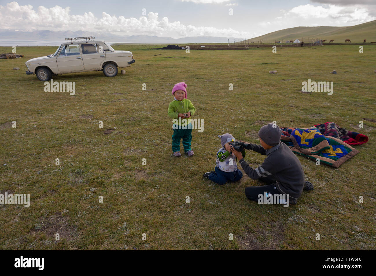 nomad children playing by Soviet era car Stock Photo - Alamy