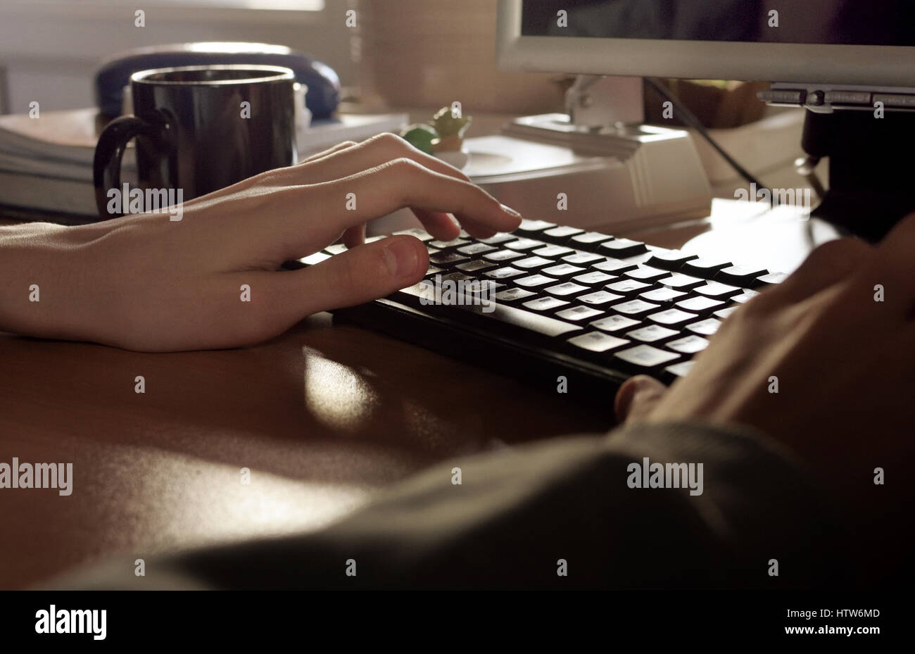 Hands on the keyboard Stock Photo - Alamy