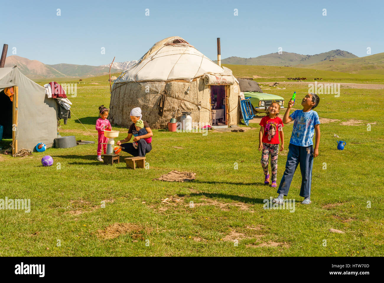 Nomad family by yurt, Kyrgyzstan Stock Photo - Alamy