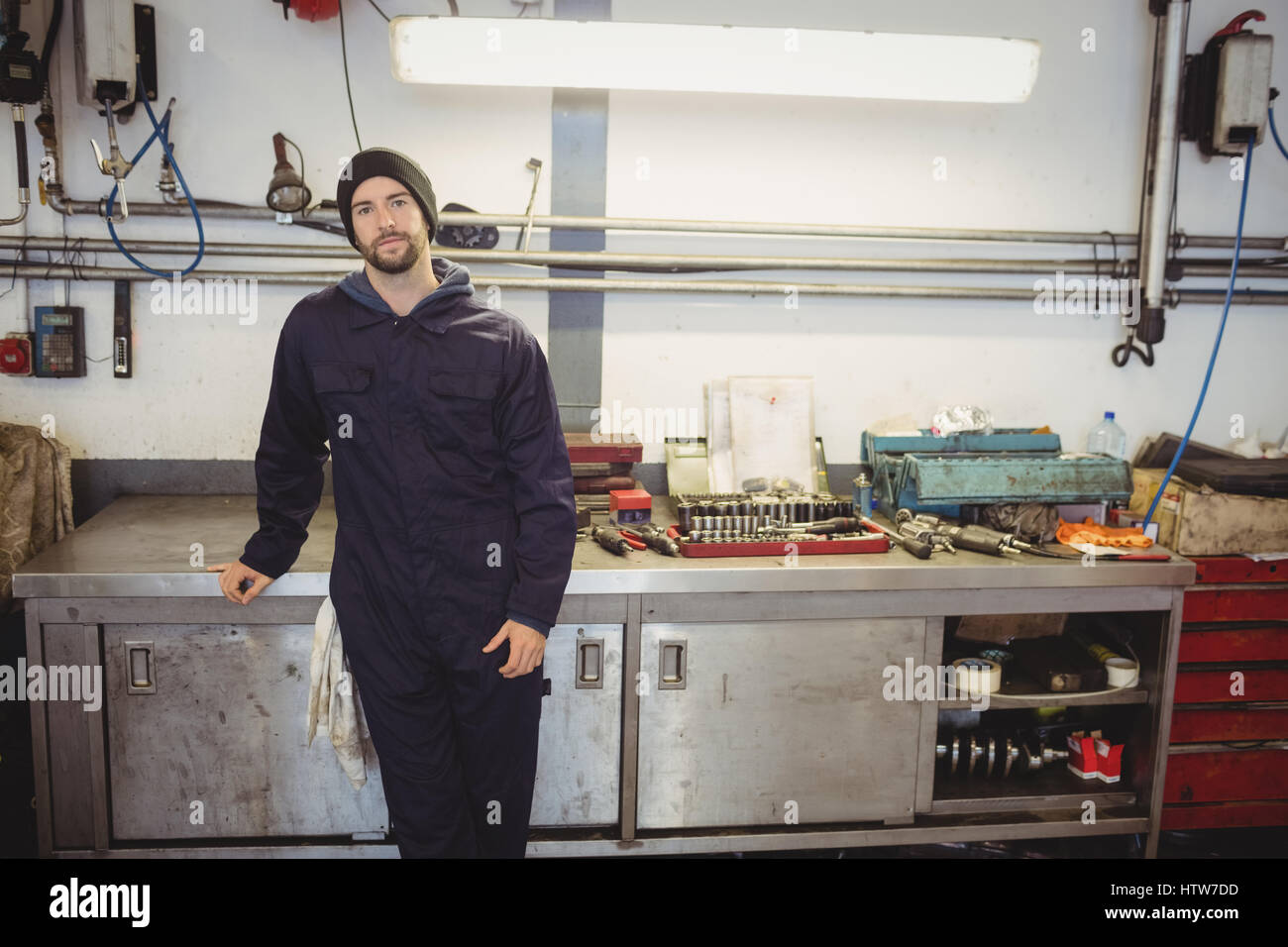 Mechanic standing in garage hi-res stock photography and images - Alamy
