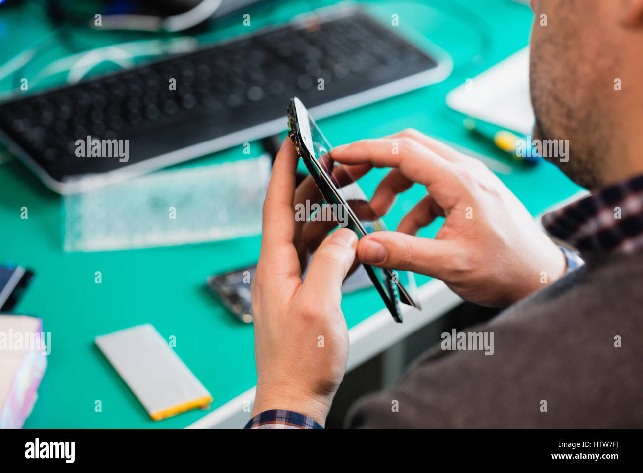 Man repairing mobile phone Stock Photo - Alamy