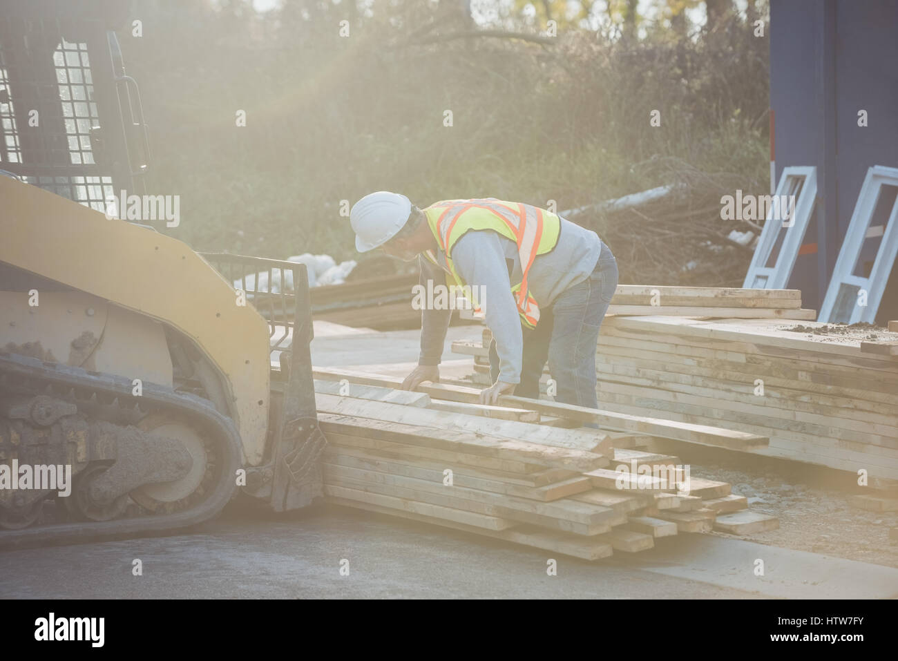 Construction worker working at construction site Stock Photo - Alamy
