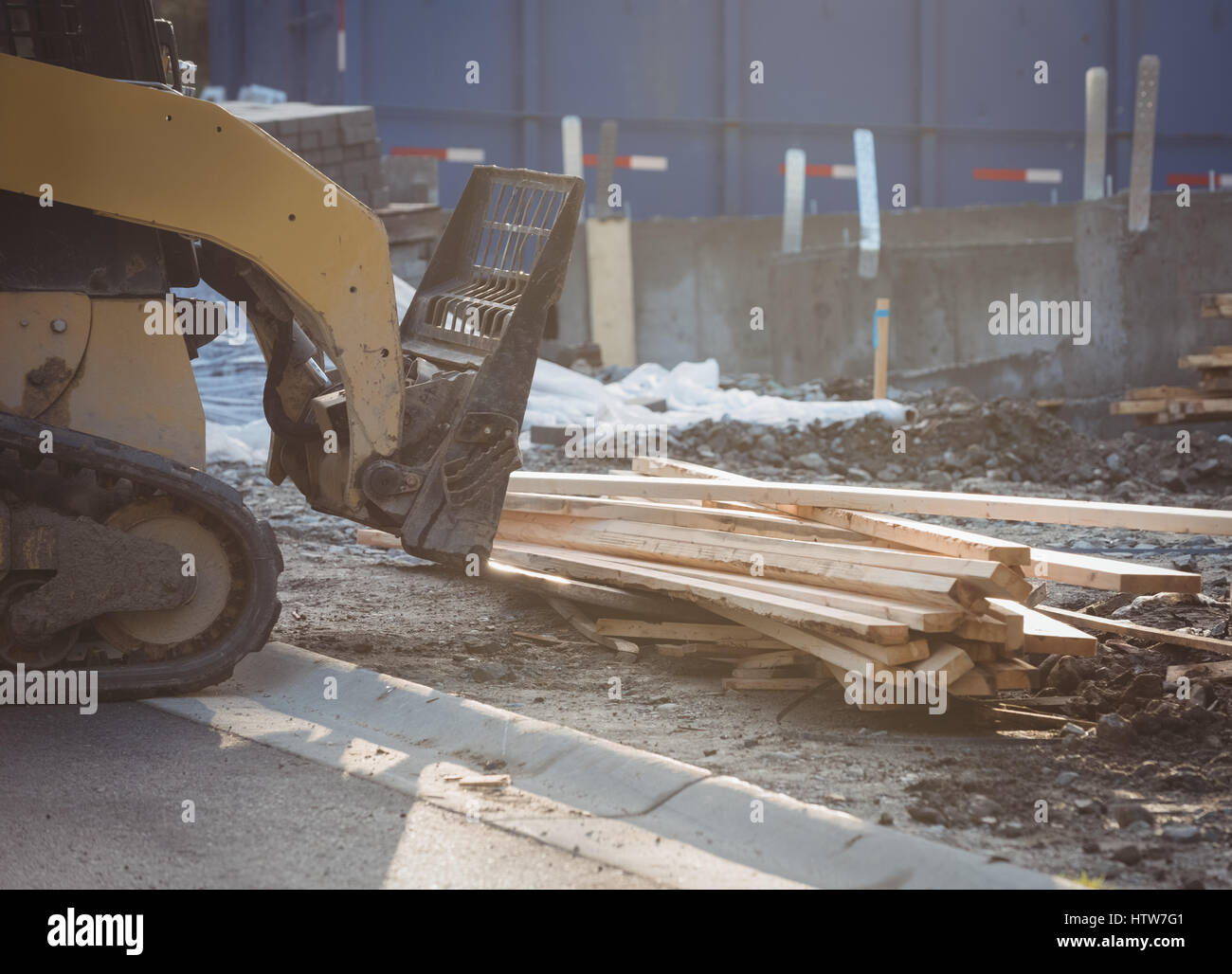 Bulldozer unloading timber Stock Photo - Alamy