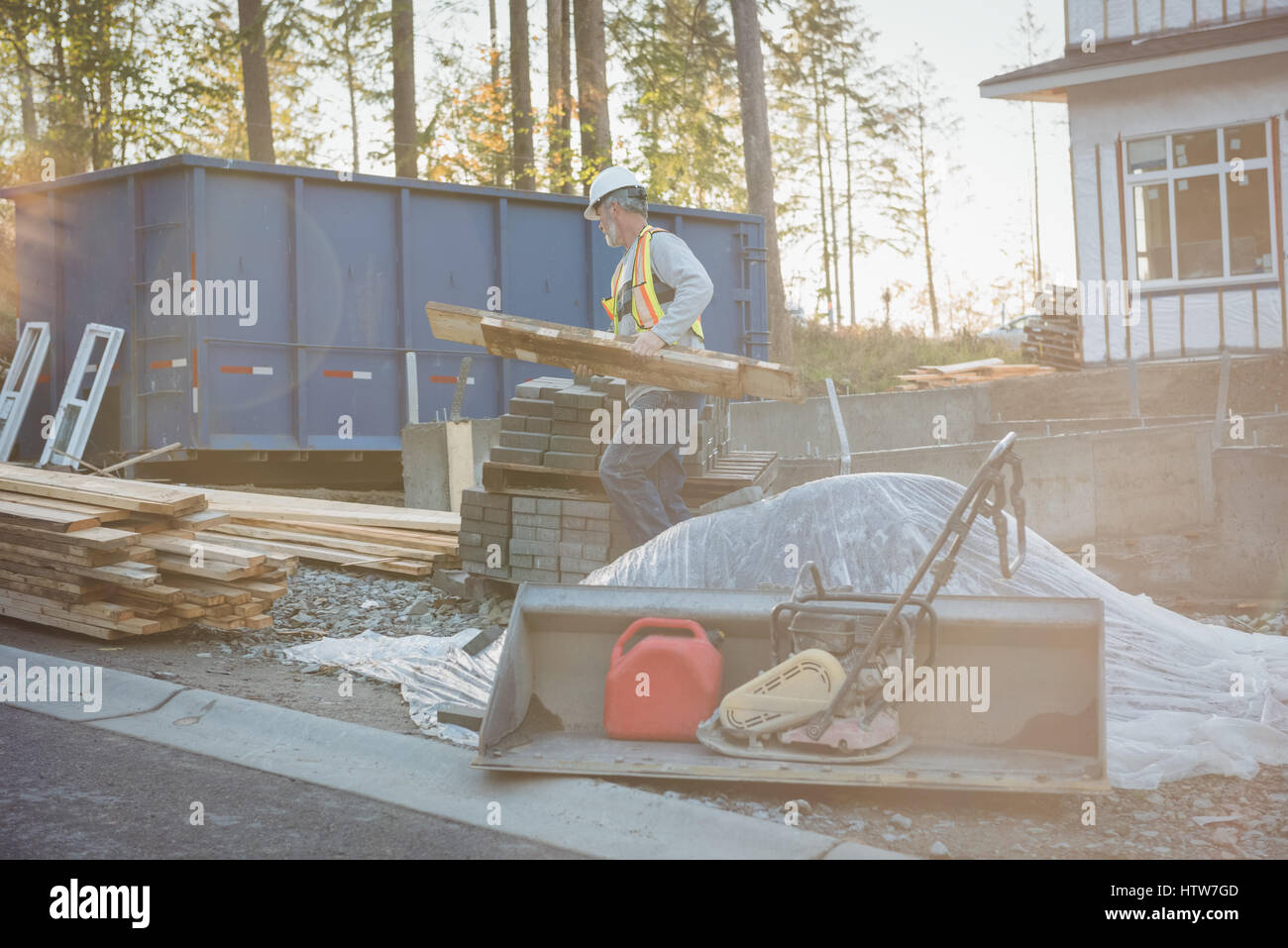 Construction worker working at construction site Stock Photo - Alamy
