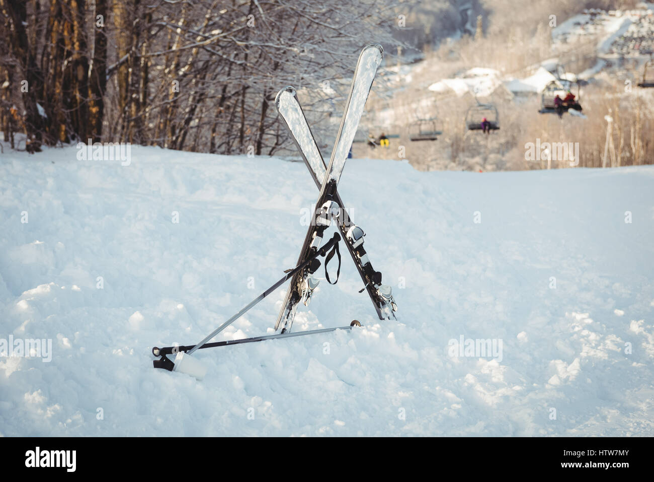 Skis standing on snowy landscape Stock Photo - Alamy