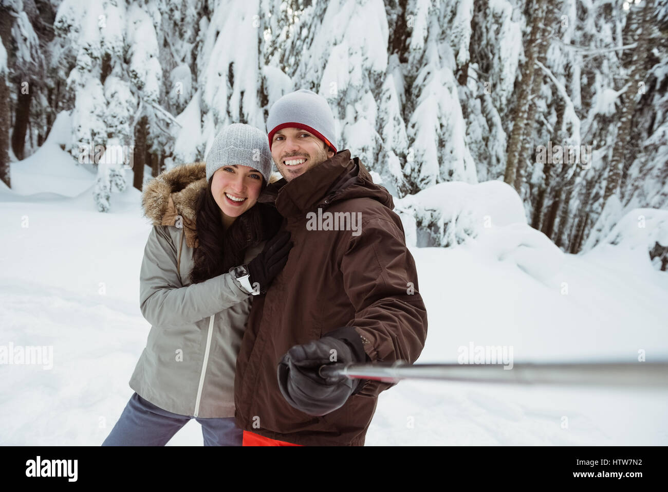 Photographing couple snow hi-res stock photography and images - Alamy